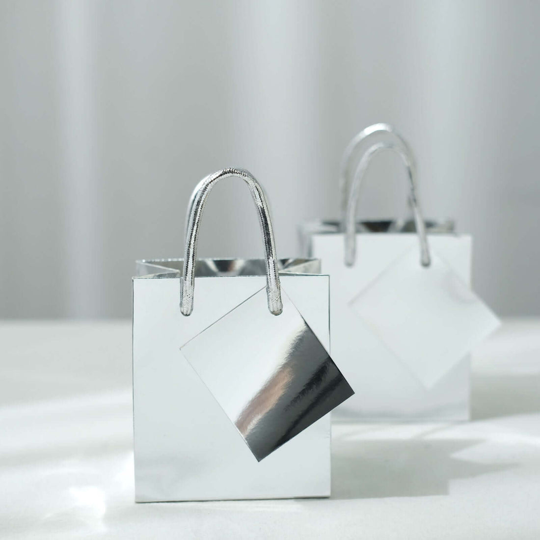 12-Pack 5" Silver Foil Paper Gift Bags | eFavormart